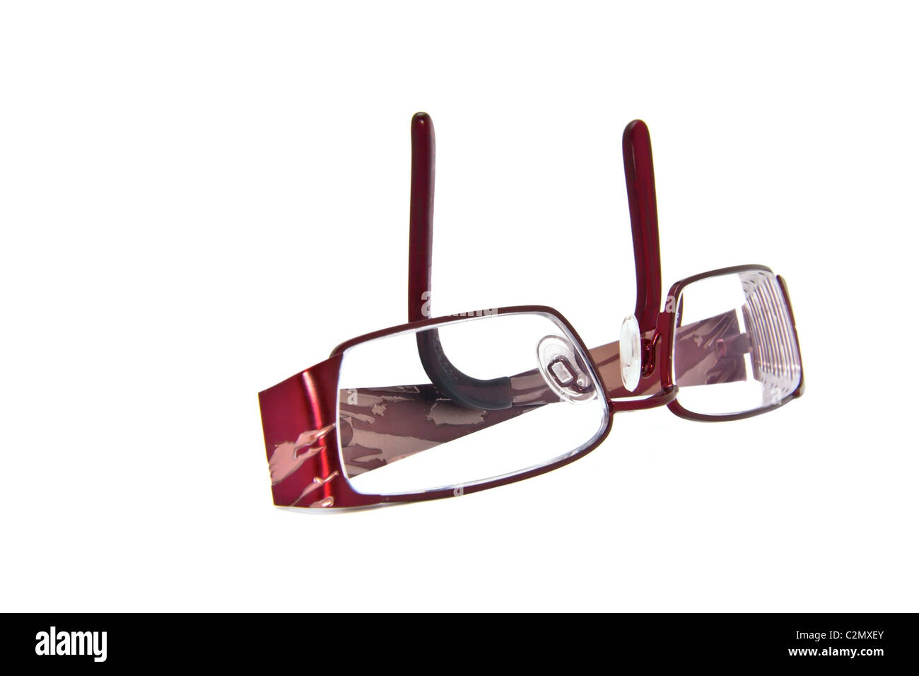 A pair of folded eye glasses on a white background Stock Photo - Alamy