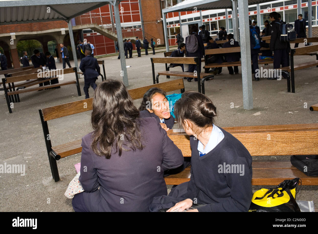 Girls of mixed race and religion in the playground of a UK school ...
