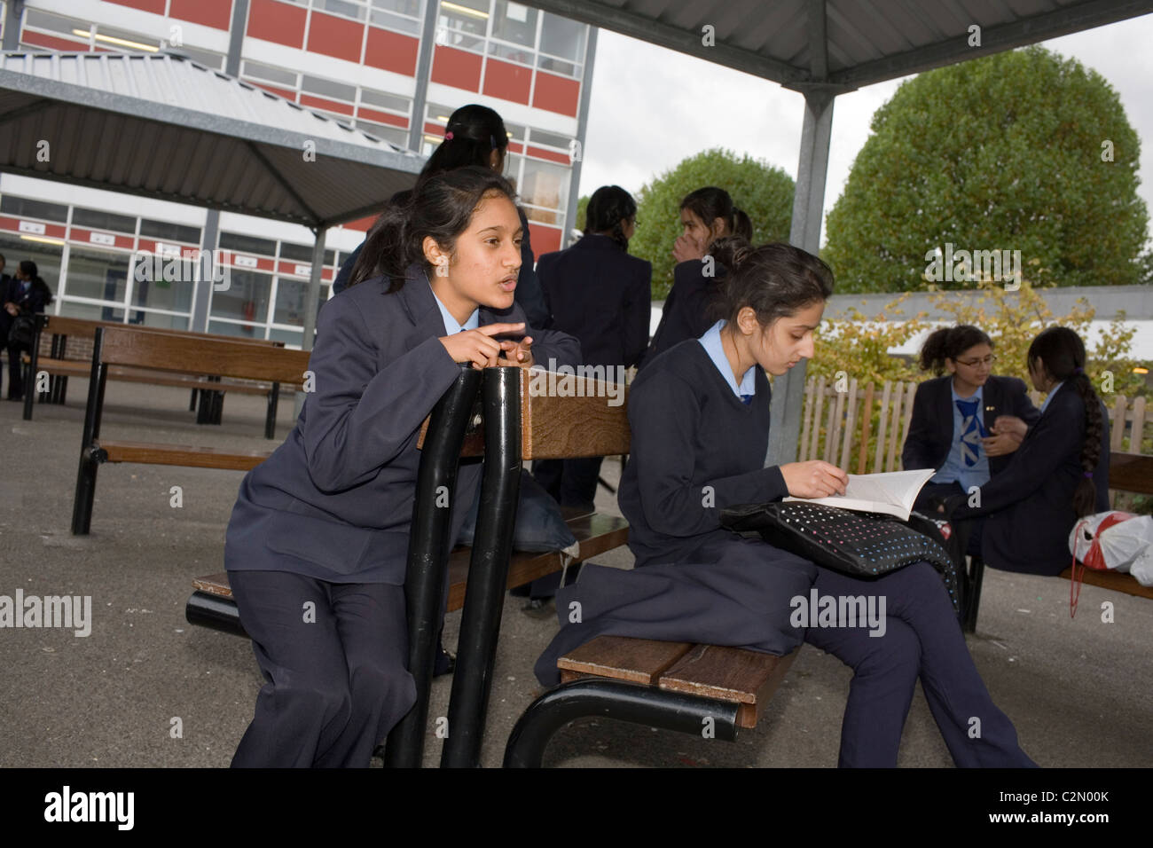 Girls of mixed race and religion in the playground of a UK school ...