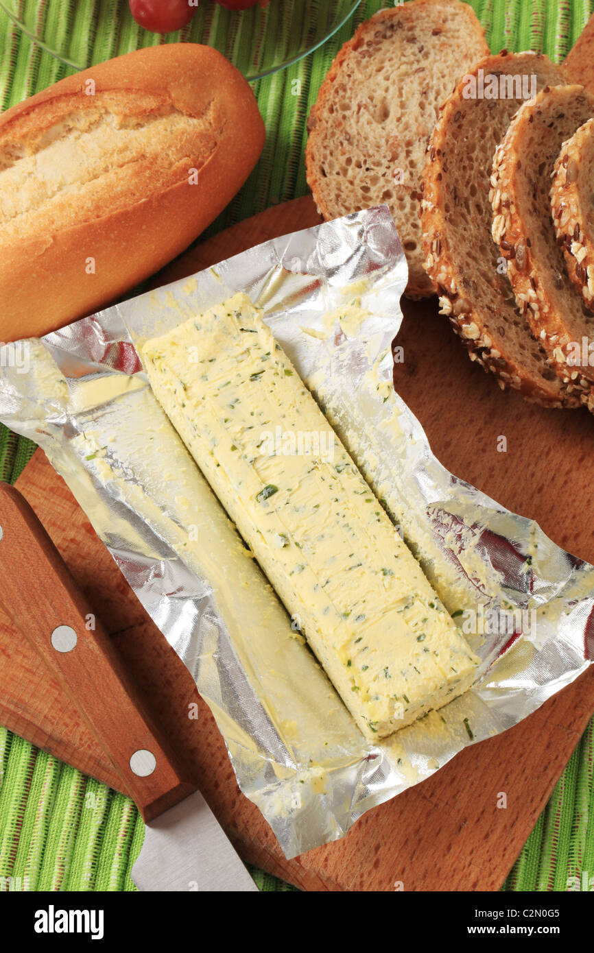 Stick of fresh herb butter and bread Stock Photo - Alamy