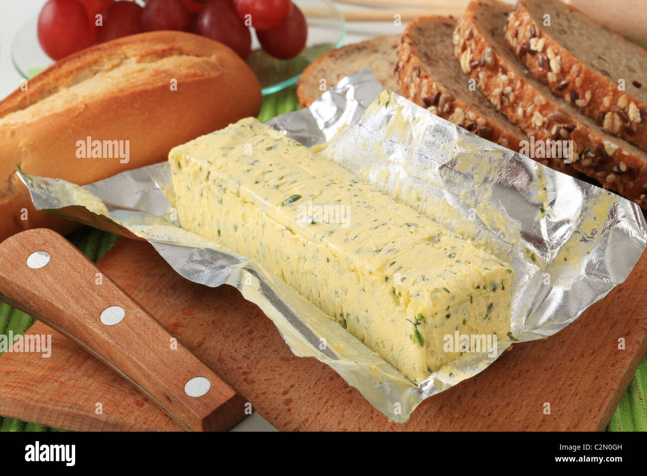 Stick of fresh herb butter and bread Stock Photo - Alamy
