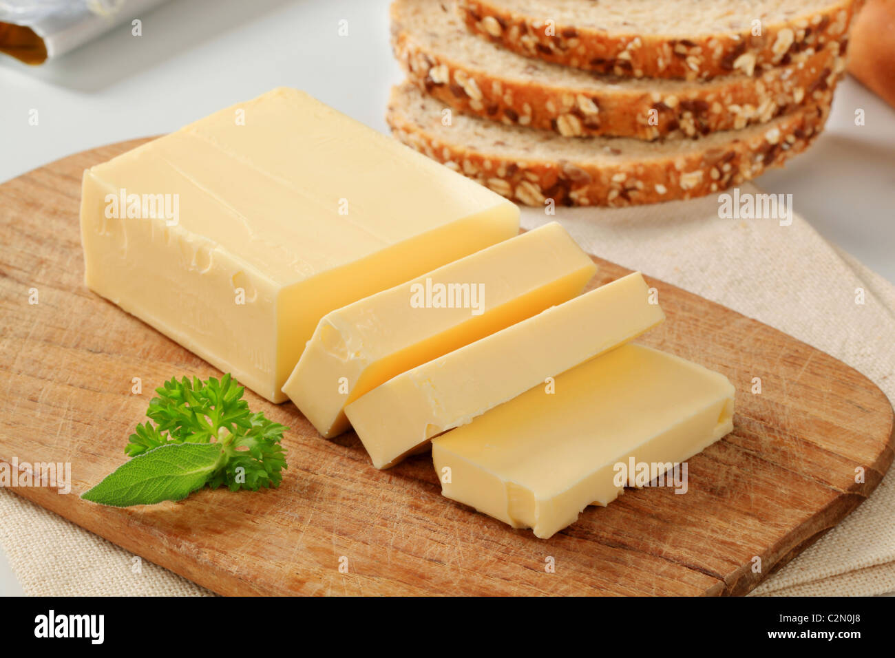 Block of fresh butter on a cutting board Stock Photo - Alamy