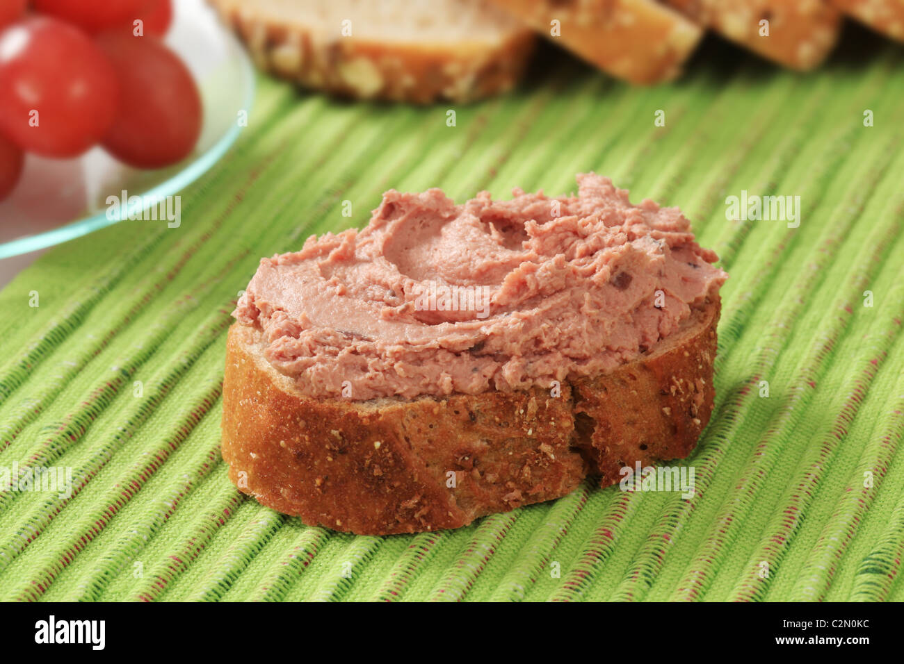 Slice of bread roll and liver pate Stock Photo - Alamy