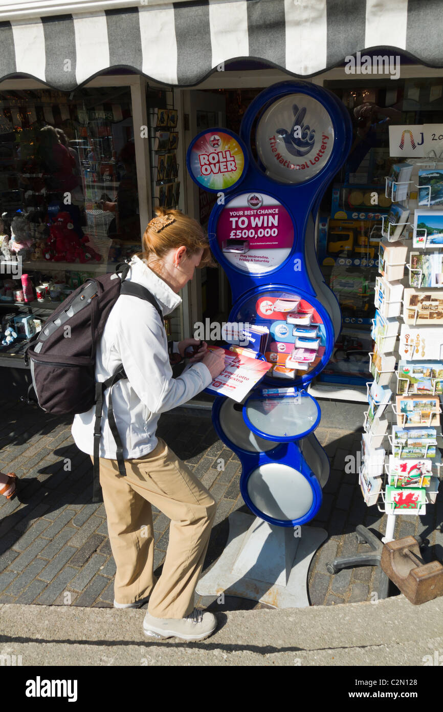 Lady filling in a Lotto ticket Stock Photo - Alamy