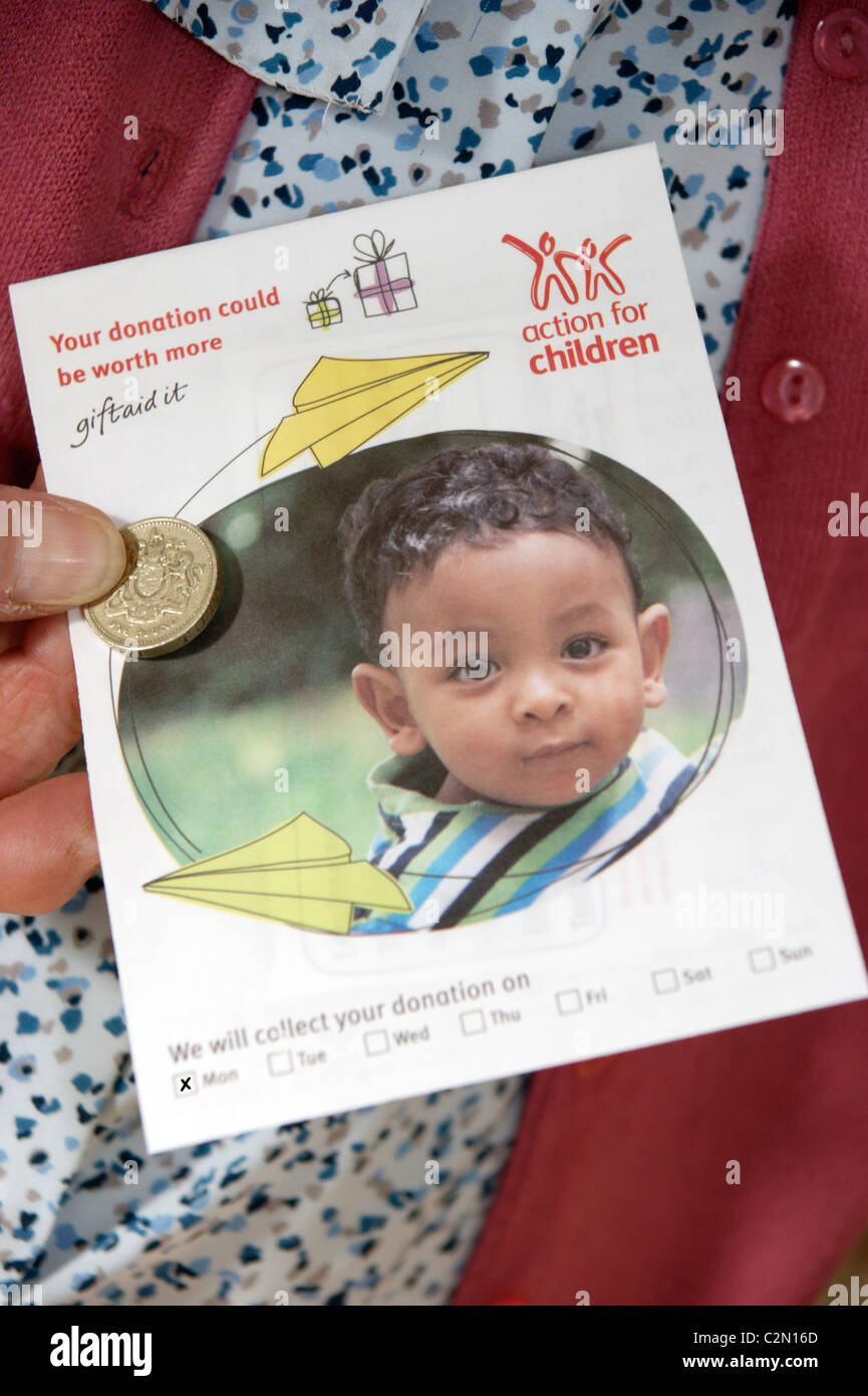 elderly woman holding donation of money for a charity collecting ...