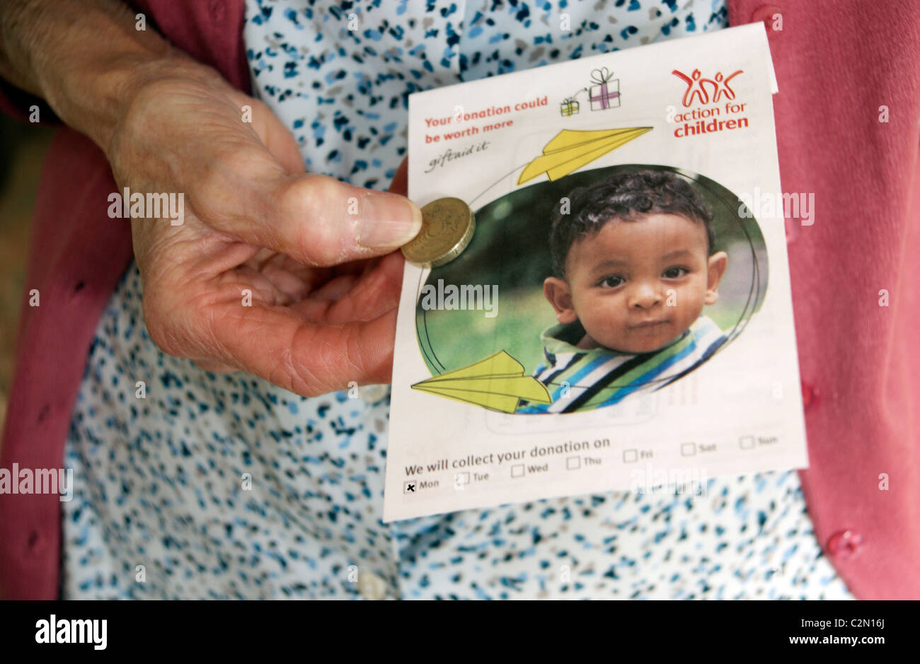 elderly woman holding donation of money for a charity collecting ...