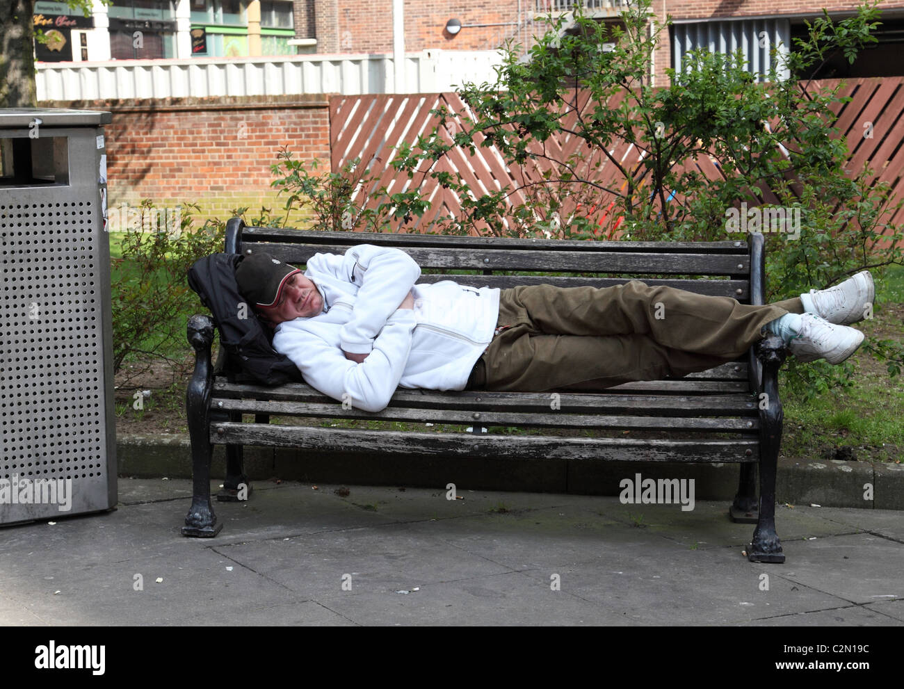 Drunk man asleep on park hi-res stock photography and images - Alamy