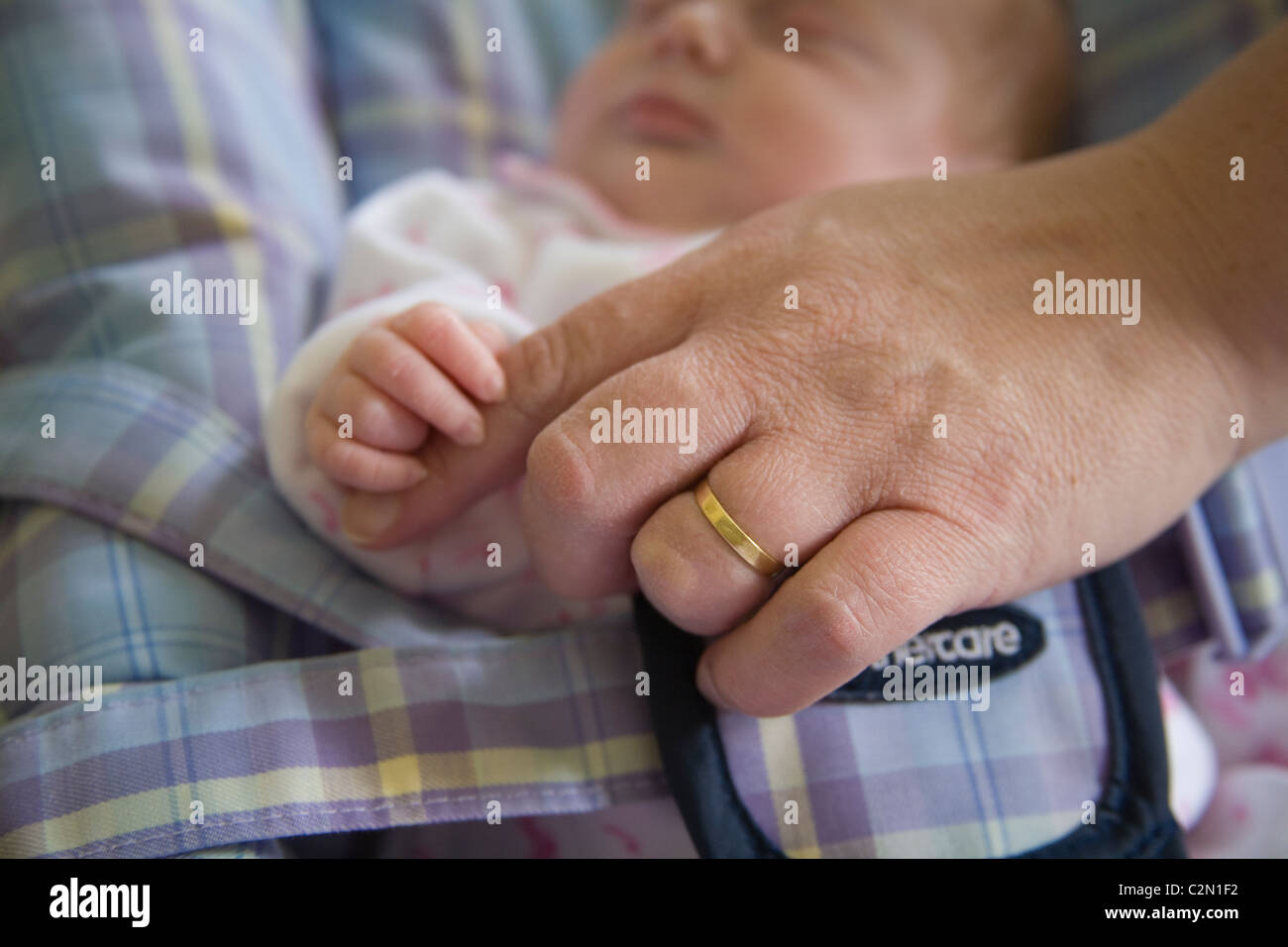 Baby hand holding finger ring hi-res stock photography and images - Alamy