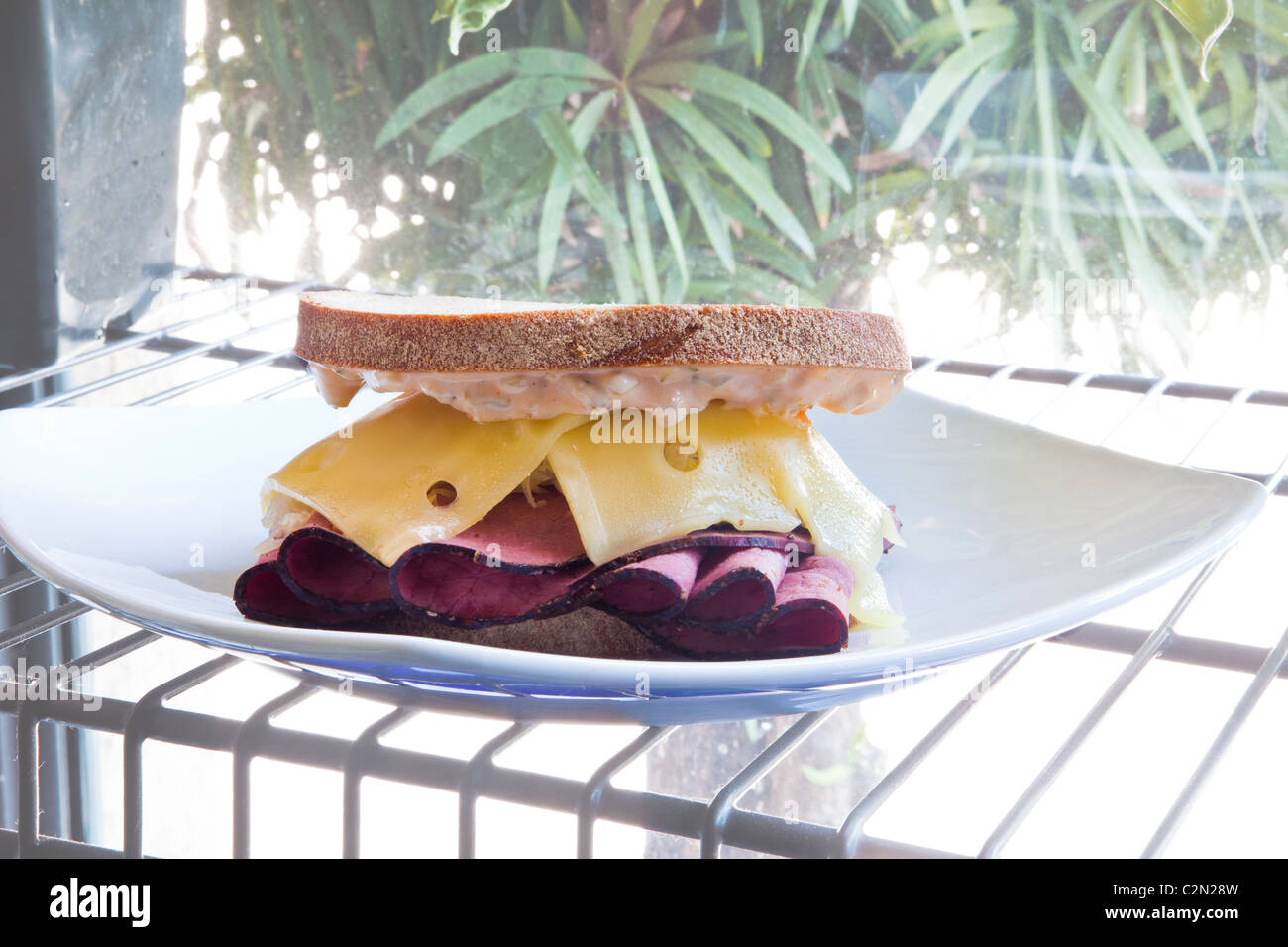 A Reuben sandwich on a white plate Stock Photo - Alamy
