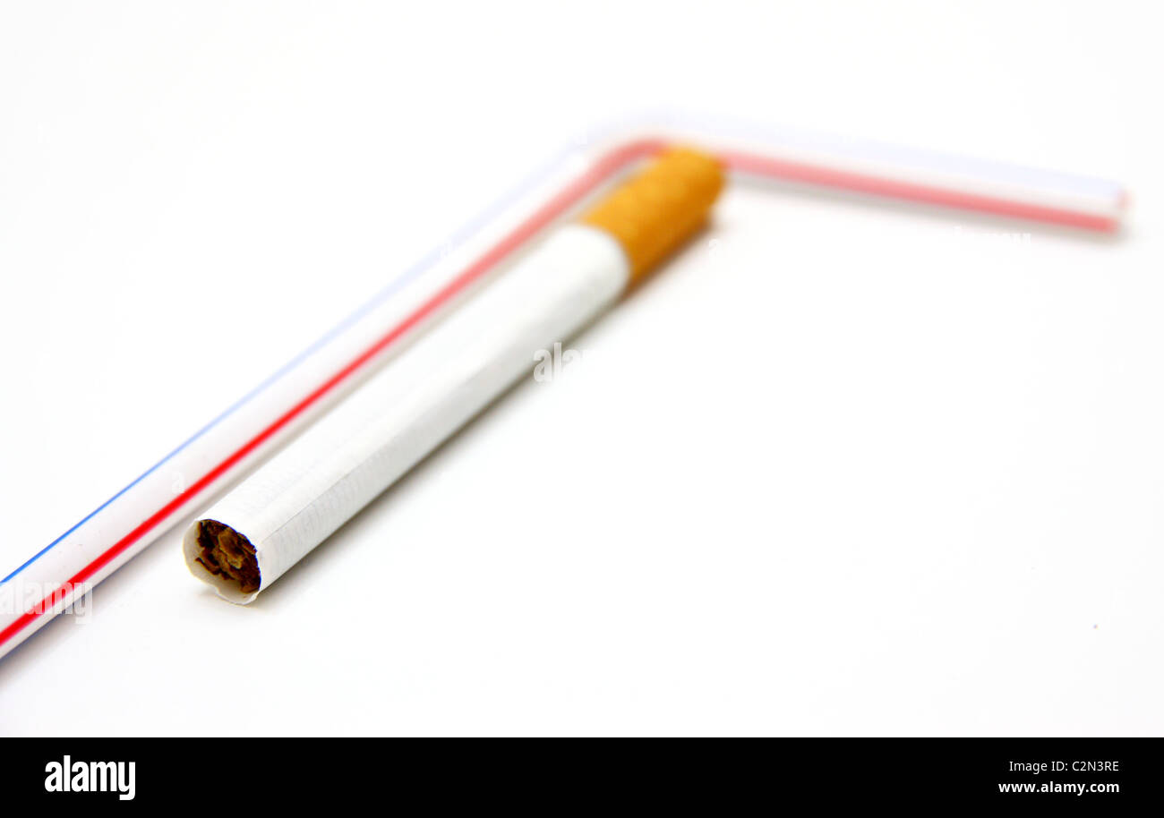 One cigarette and tubule for juice on a white background Stock Photo ...