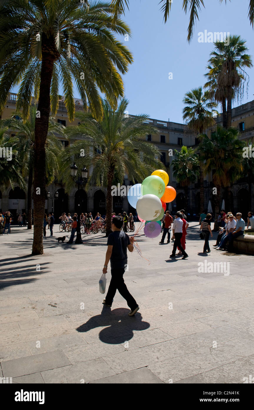 Man walking with colourful balloons in Placa Reial, in Barcelona Stock ...