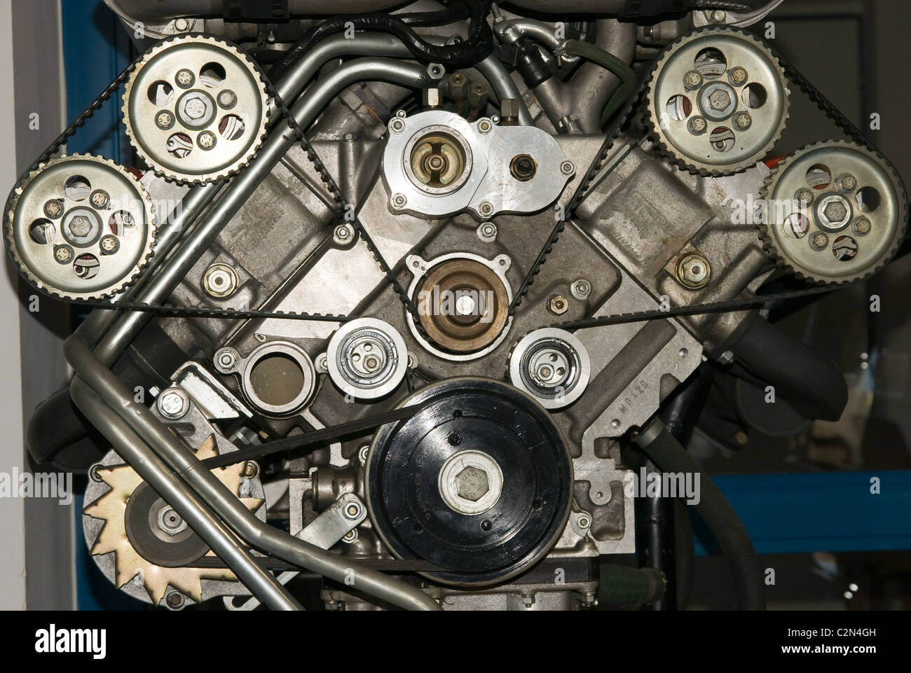 Converging on an old engine valve mechanism and gears Stock Photo - Alamy
