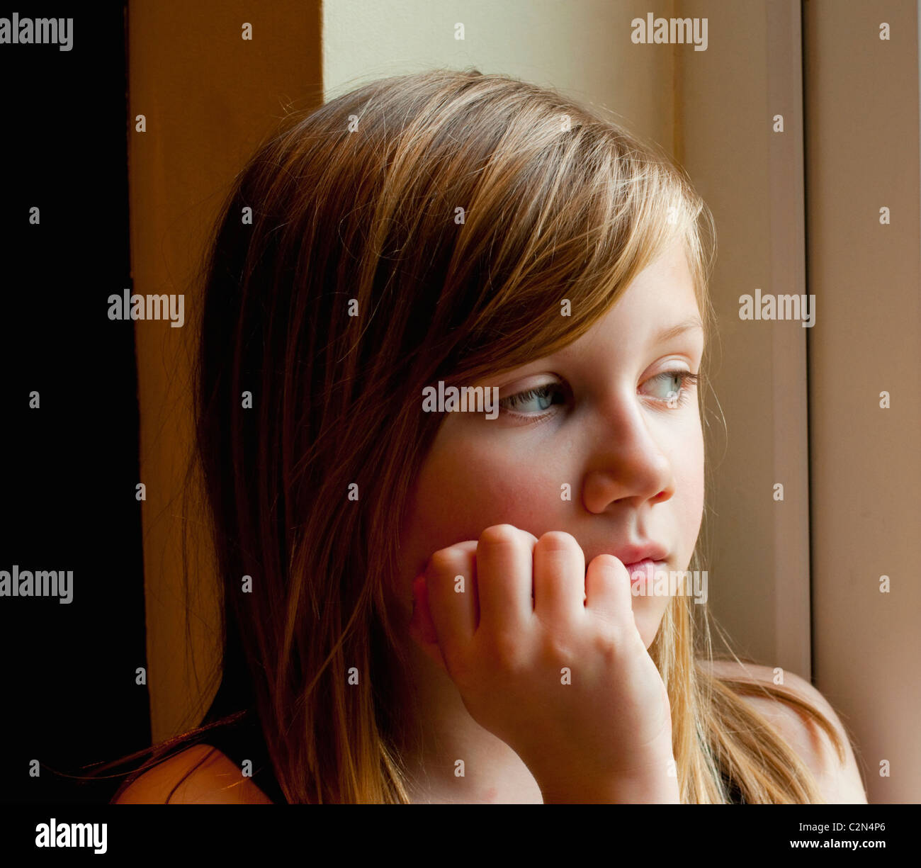 A pretty young girl thinking Stock Photo - Alamy