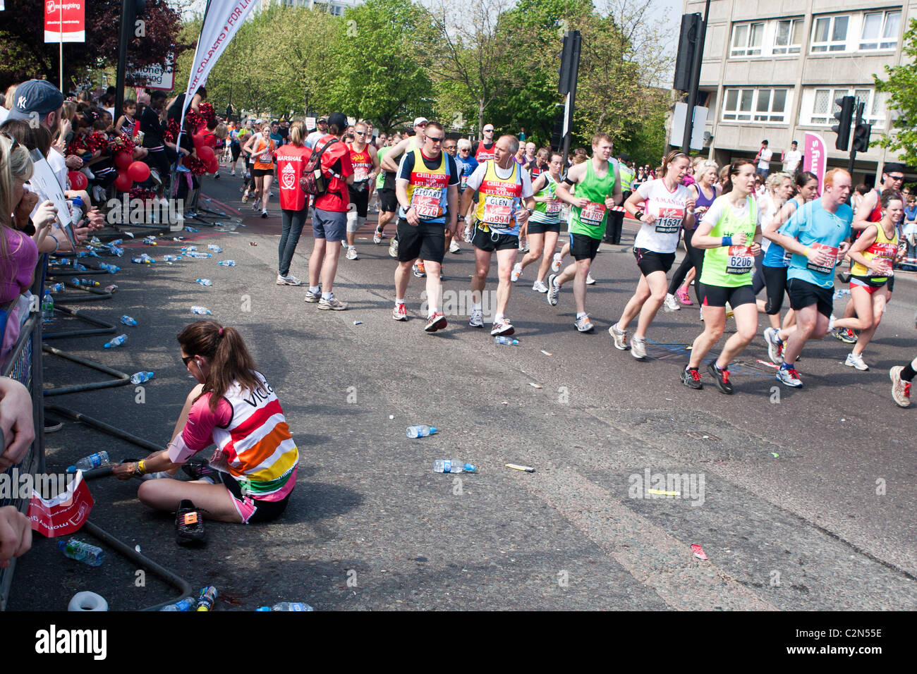 A runner resting at the Virgin London Marathon 2011 Stock Photo - Alamy