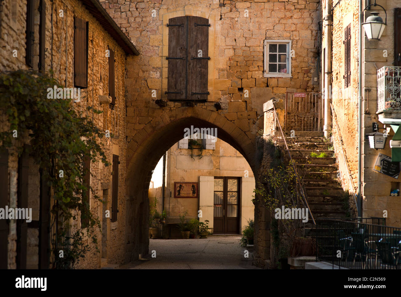 stOld medieval town center with archway in the Dordogne region of ...