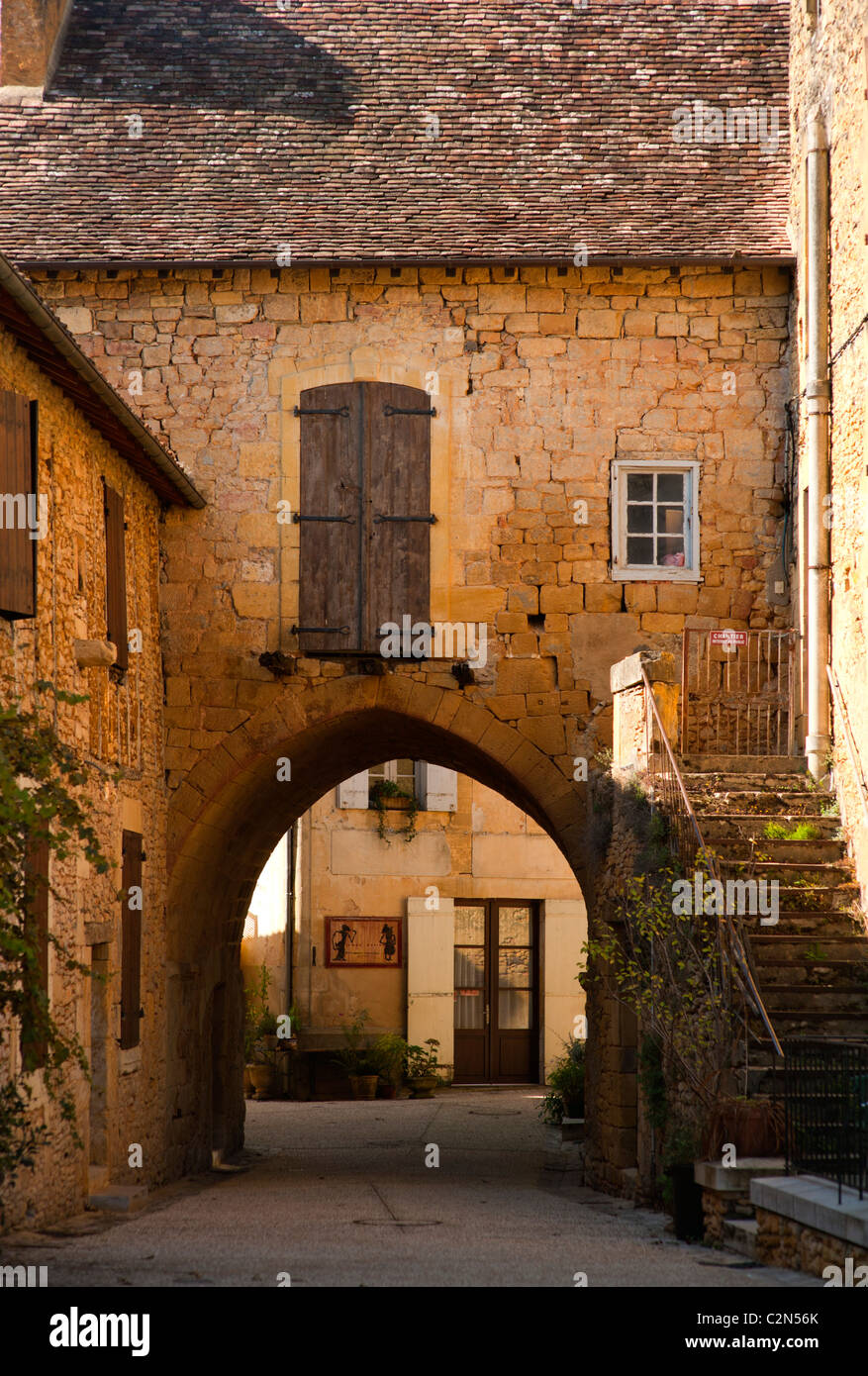 stOld medieval town center with archway in the Dordogne region of ...