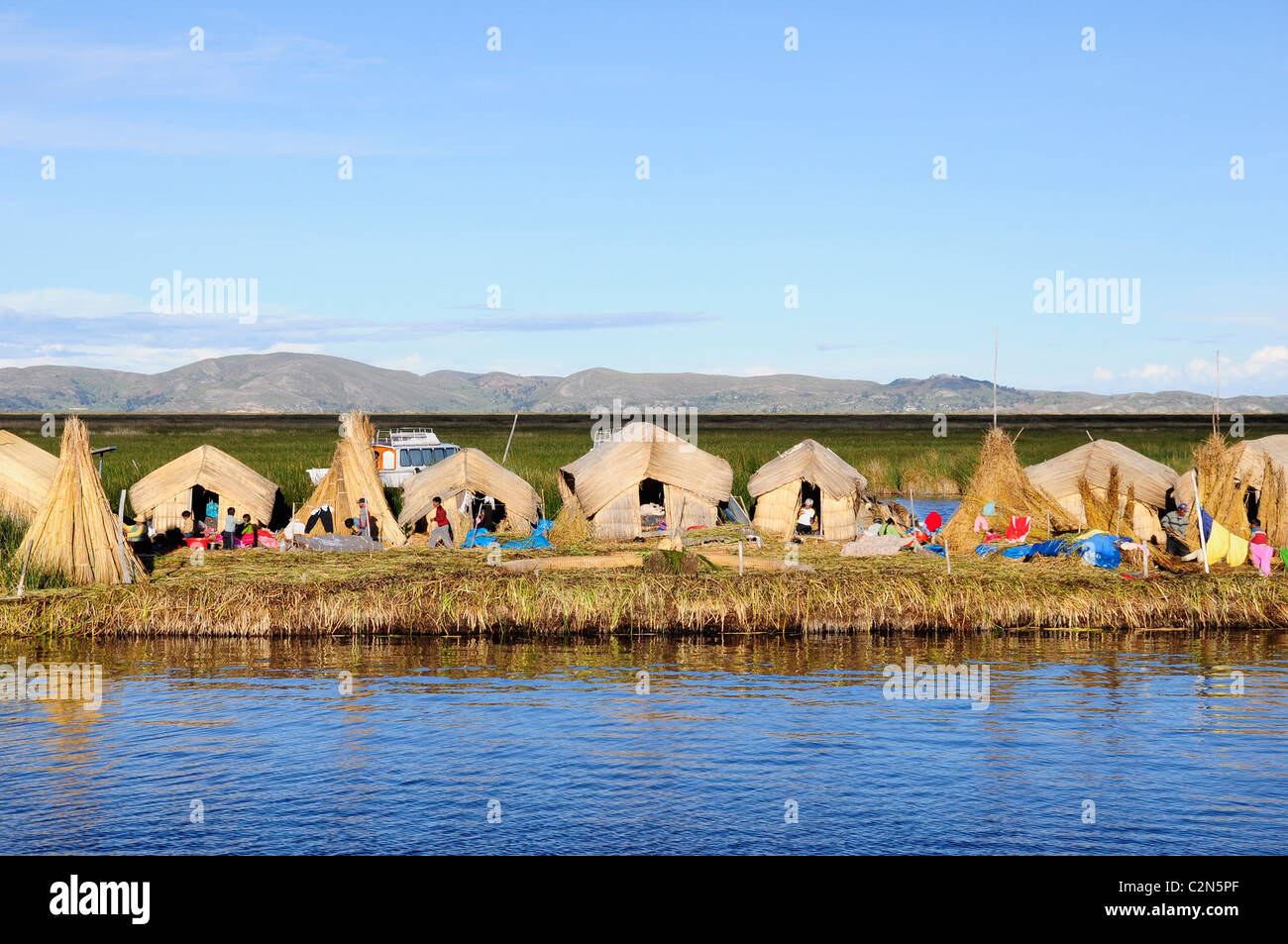 Traditional houes at the floating island in Peru Stock Photo - Alamy