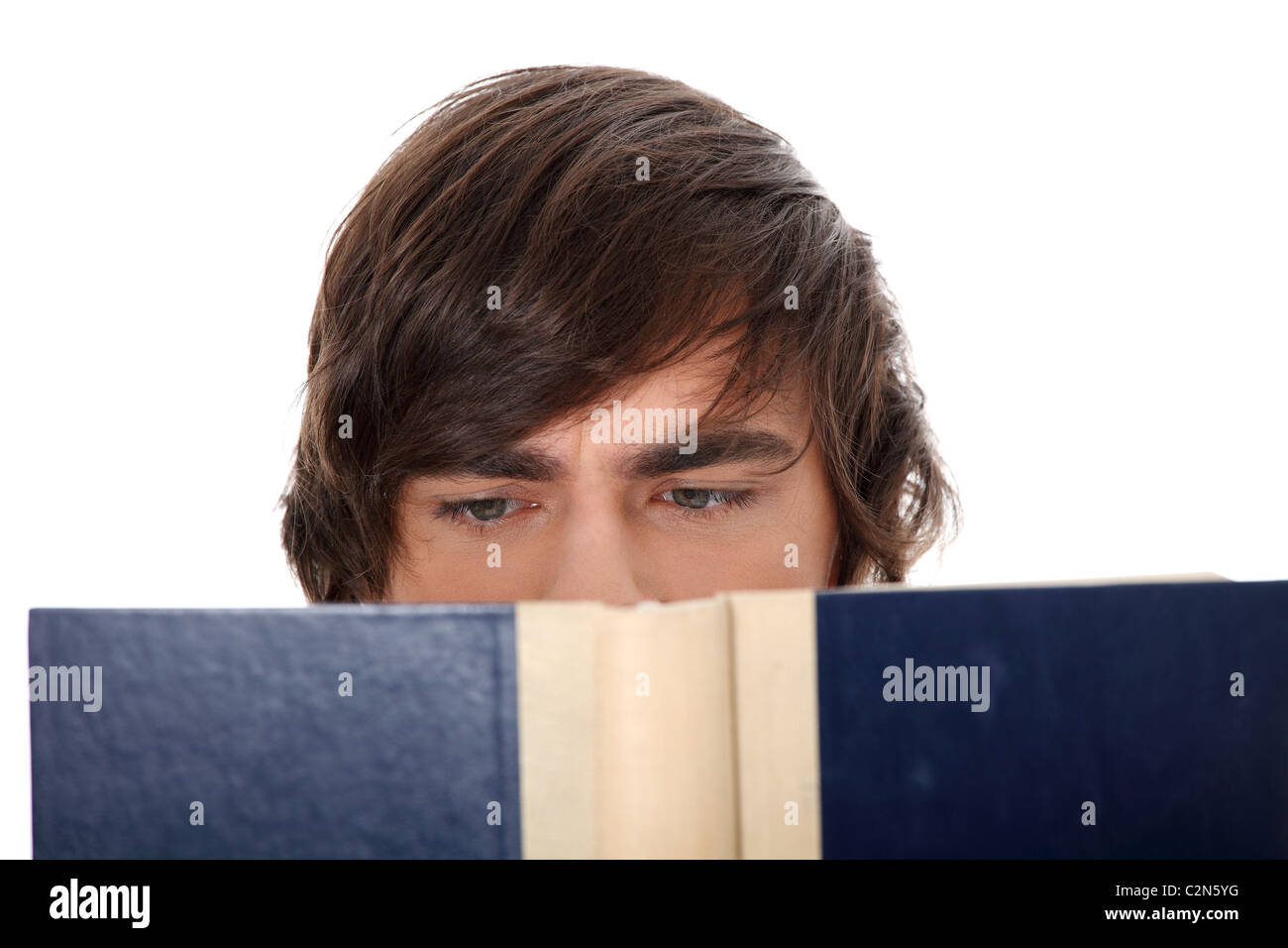 Young man reading book , isolated on white background Stock Photo - Alamy
