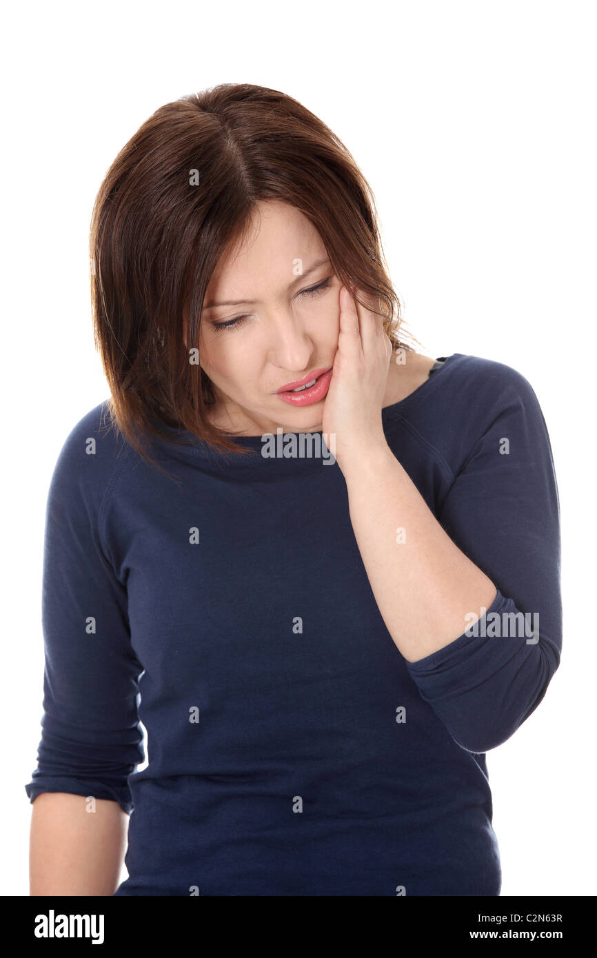 Attractive woman in her 40s pressing her bruised cheek with a painful ...