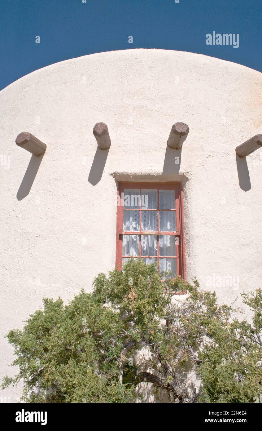 Wood vigas (beams) project from the adobe Carrizozo Womans Club, built ...