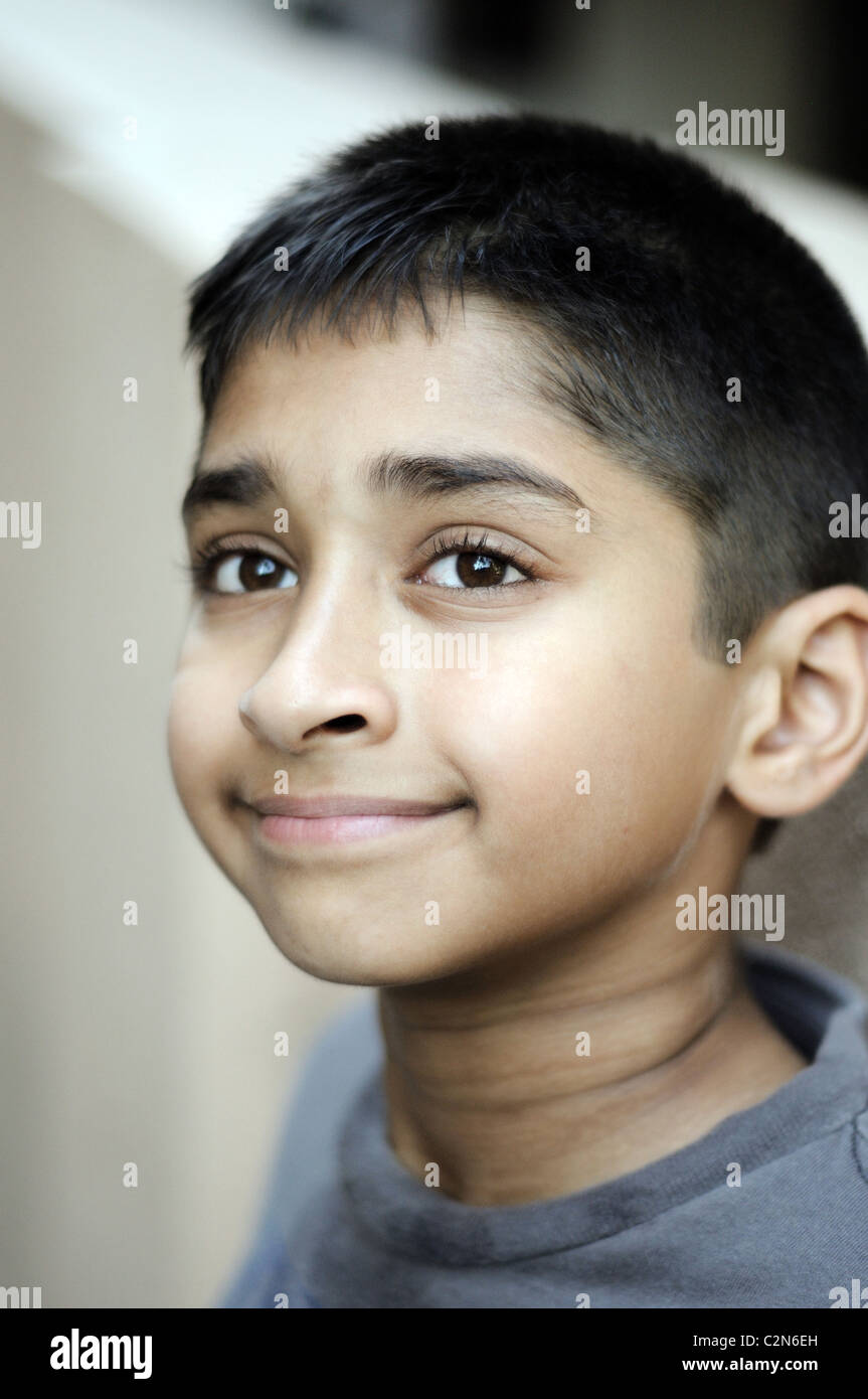 an handsome indian kid smiling happily for you Stock Photo - Alamy