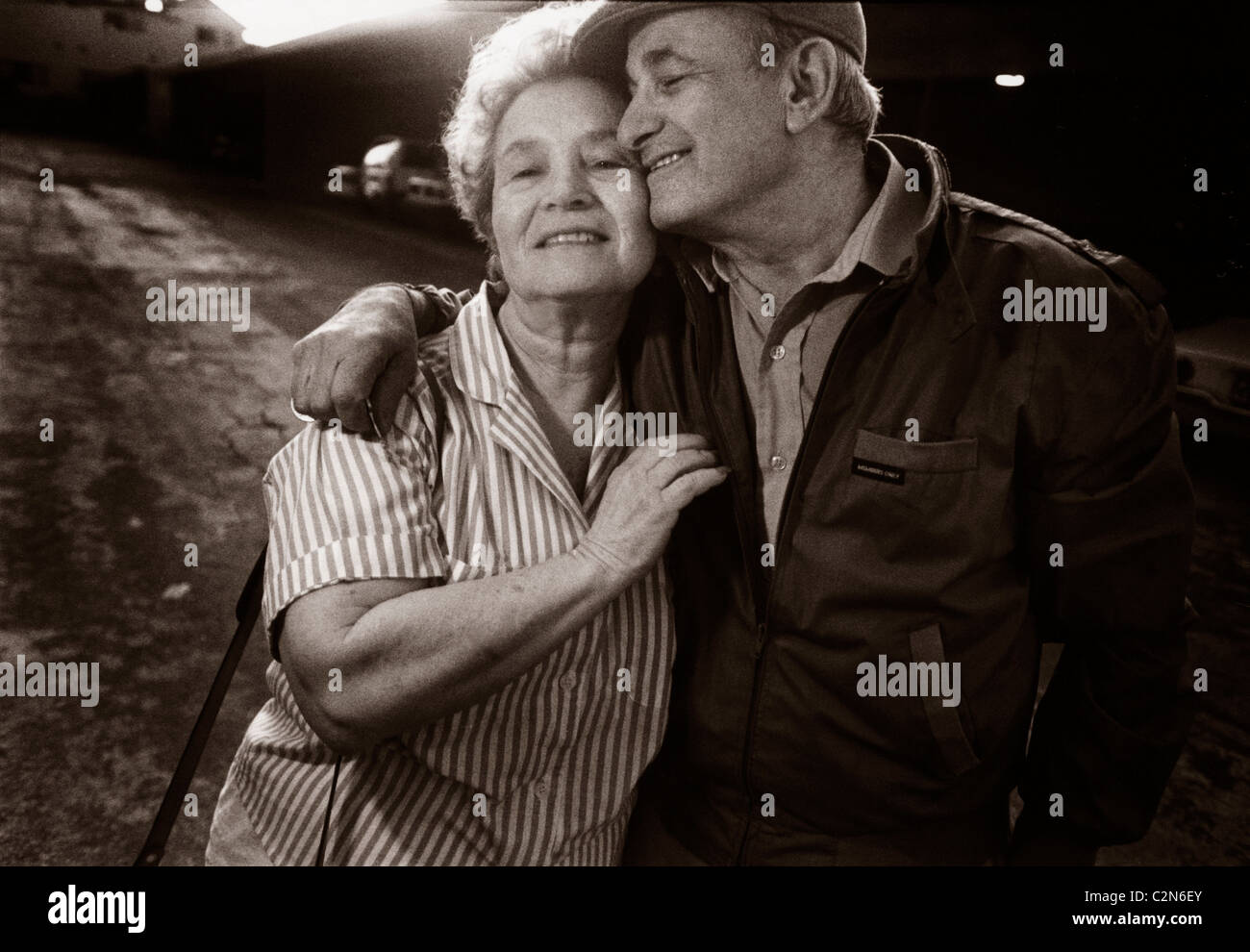 Adult middle aged married and loving couple embracing Stock Photo - Alamy