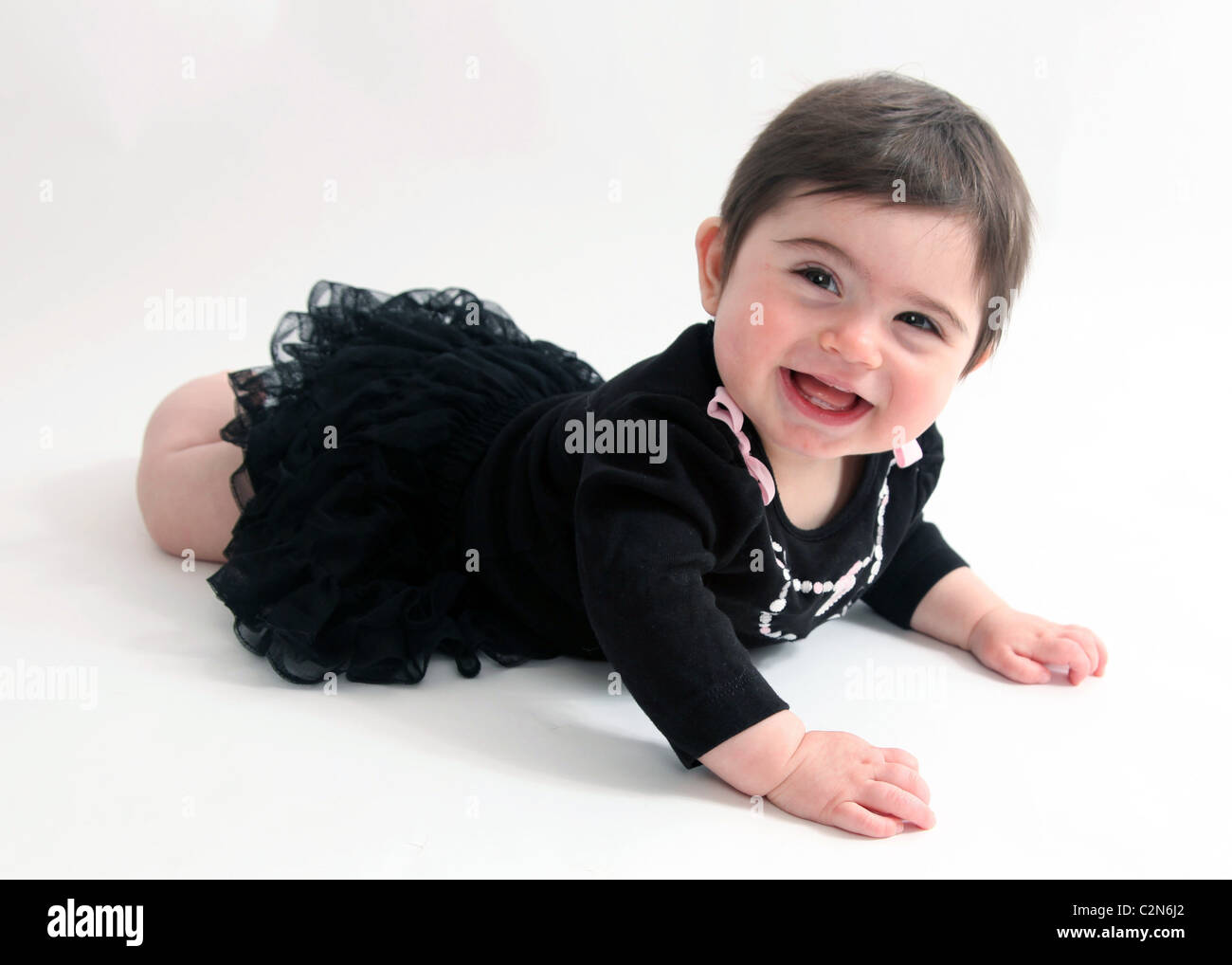 Baby girl crawling in studio Stock Photo - Alamy
