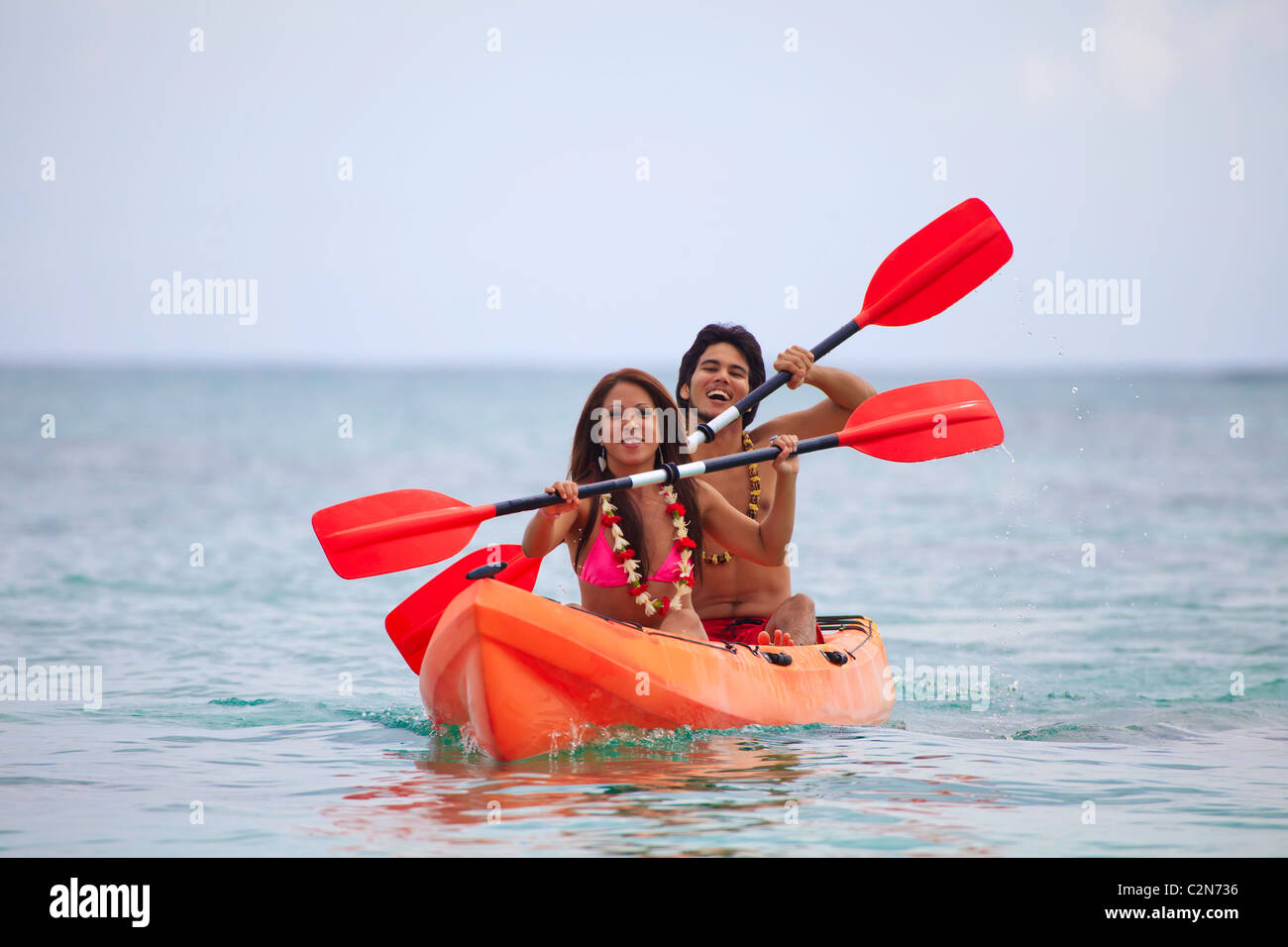 young asian couple in their kayak in hawaii Stock Photo - Alamy