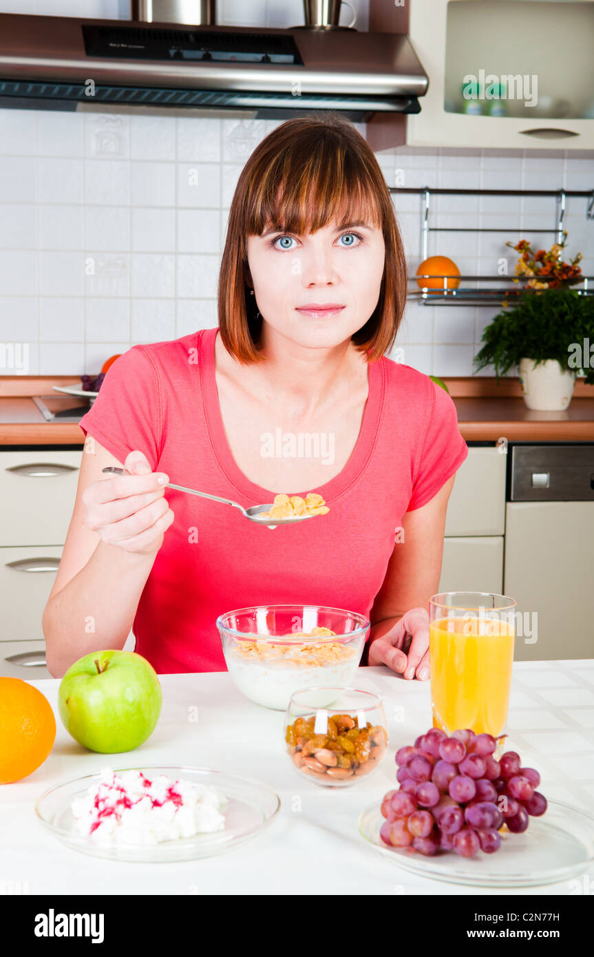 Beautiful woman having a healthy breakfast Stock Photo - Alamy