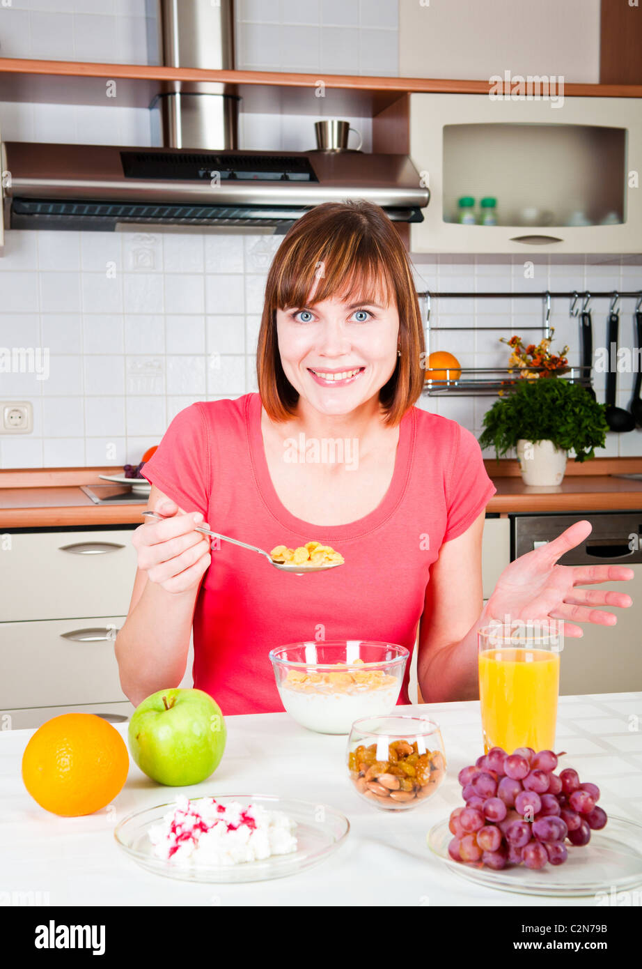 Beautiful woman having a healthy breakfast Stock Photo - Alamy