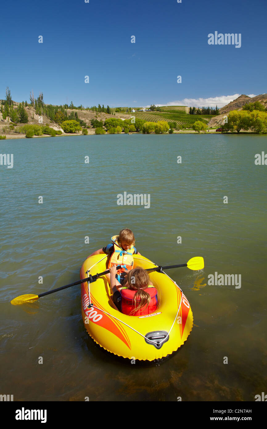 Children playing in inflatable boat hi-res stock photography and images ...