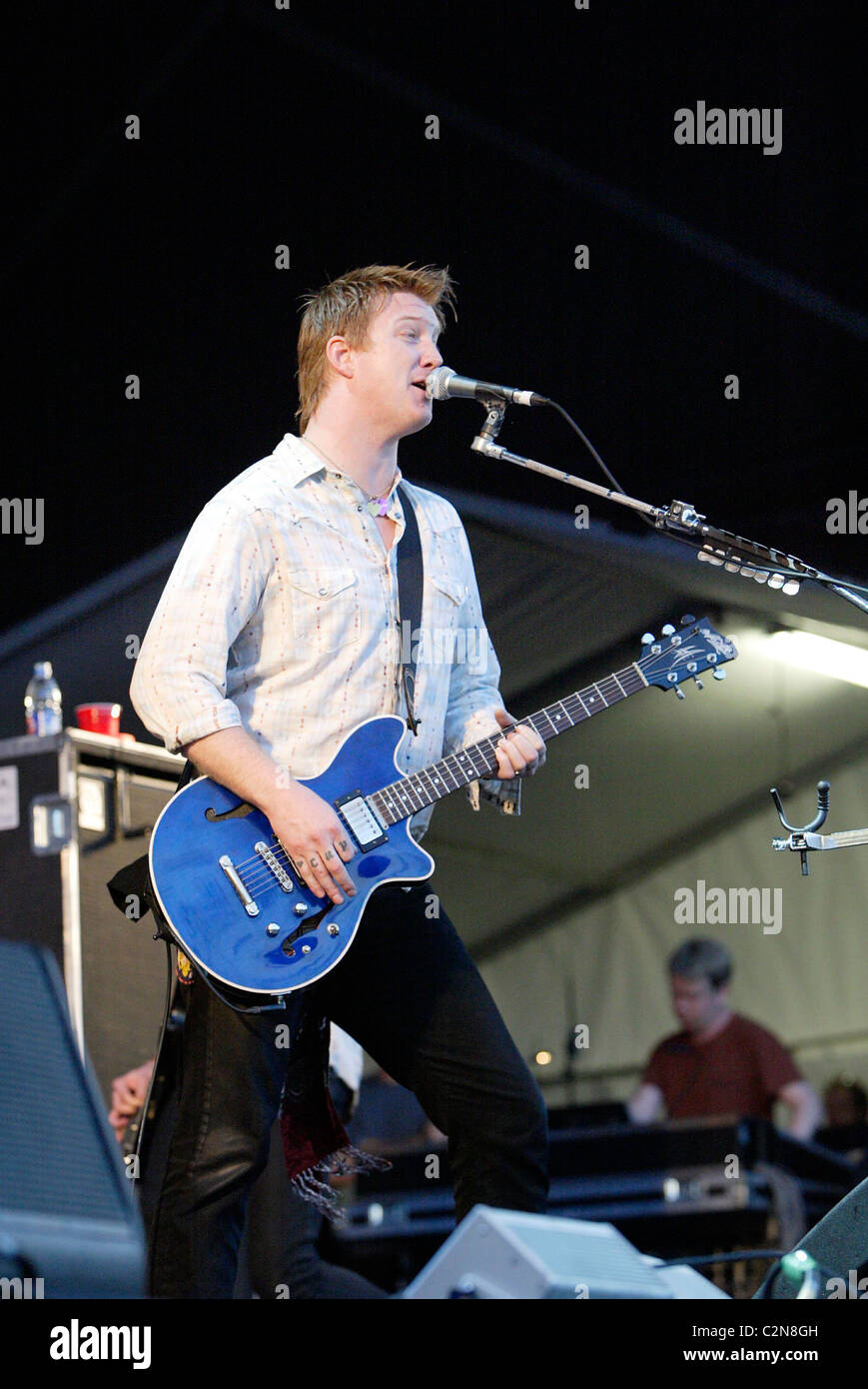 Josh Homme from Queens of the Stone Age performing live in concert as ...