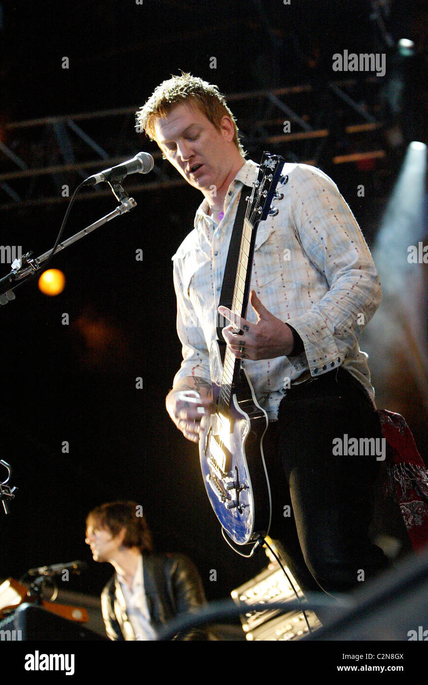 Josh Homme from Queens of the Stone Age performing live in concert as ...