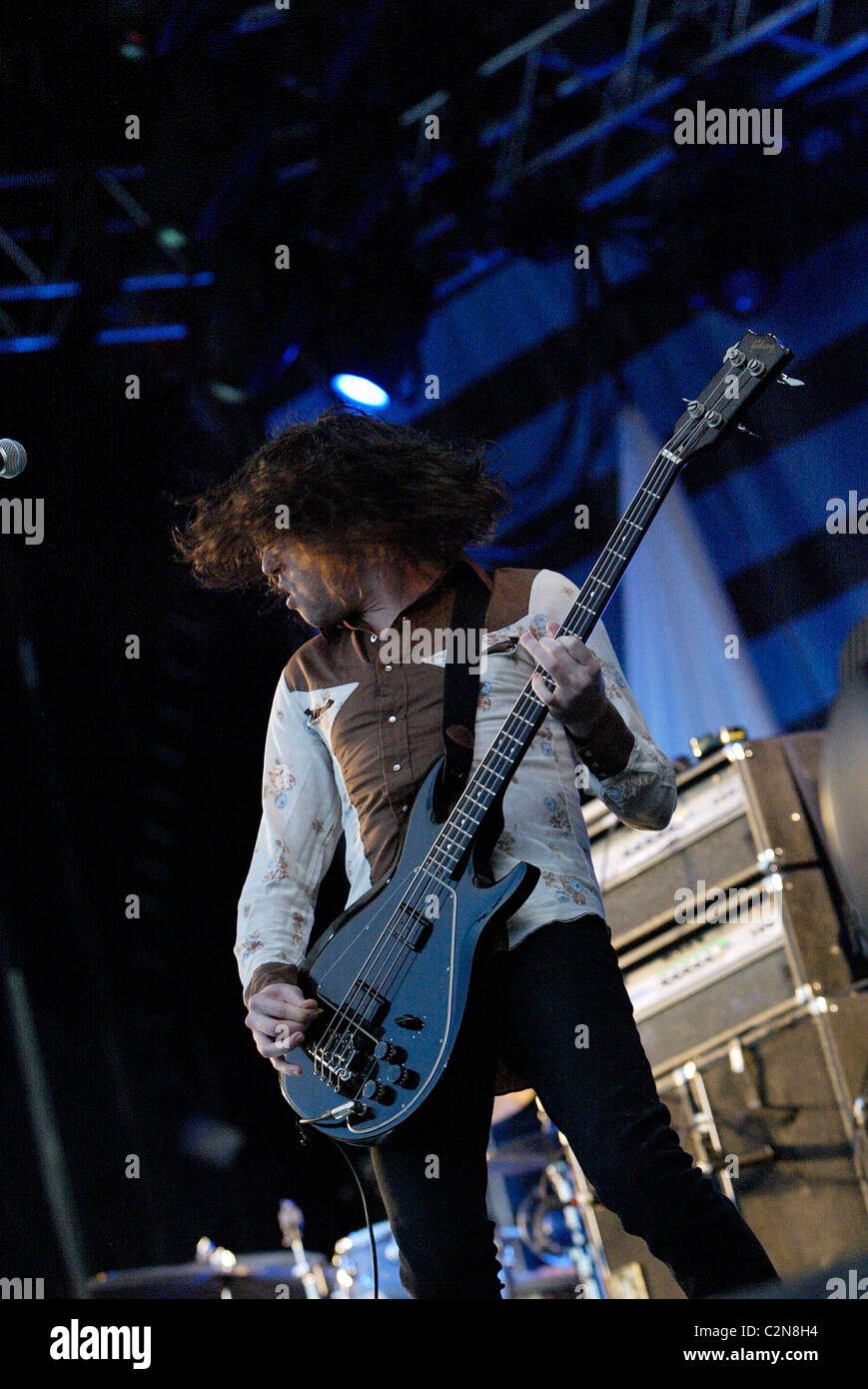 Michael Shuman from Queens of the Stone Age performing live in concert ...