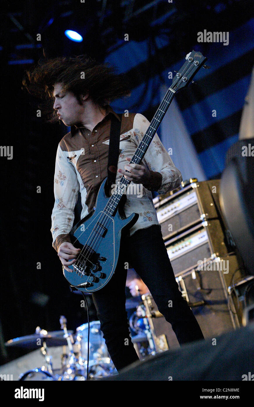 Michael Shuman from Queens of the Stone Age performing live in concert ...