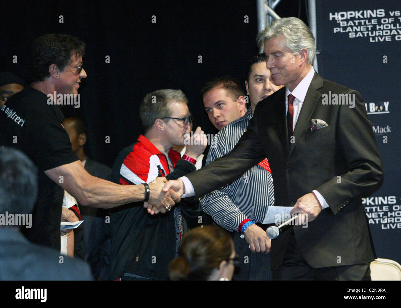 Sylvester Stallone shakes the ring announcer Michael Buffer's hand ...