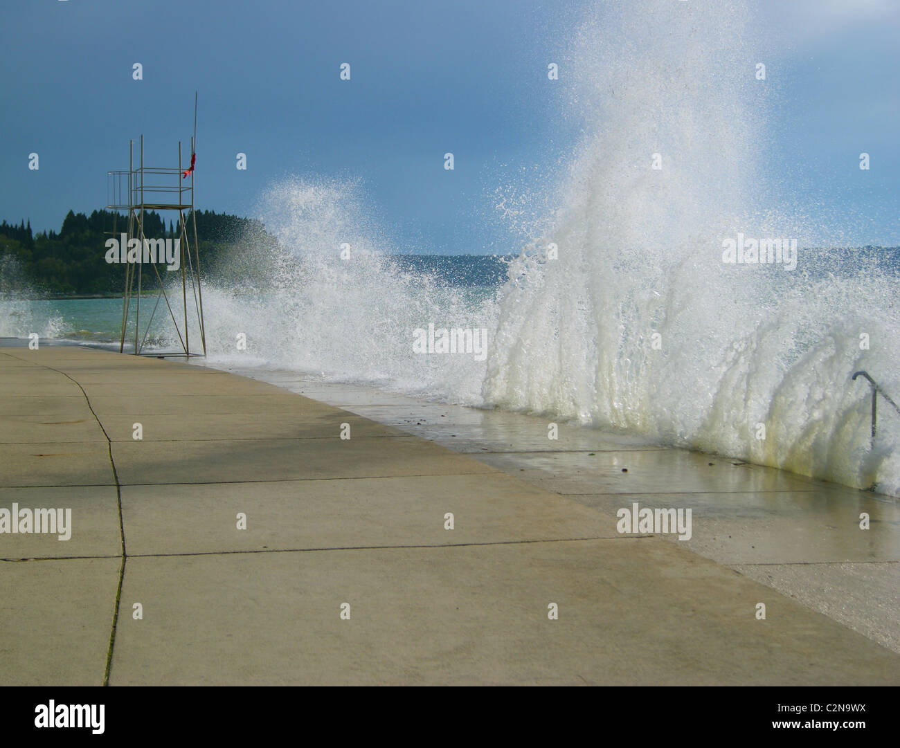 Waves hitting the beach Stock Photo - Alamy