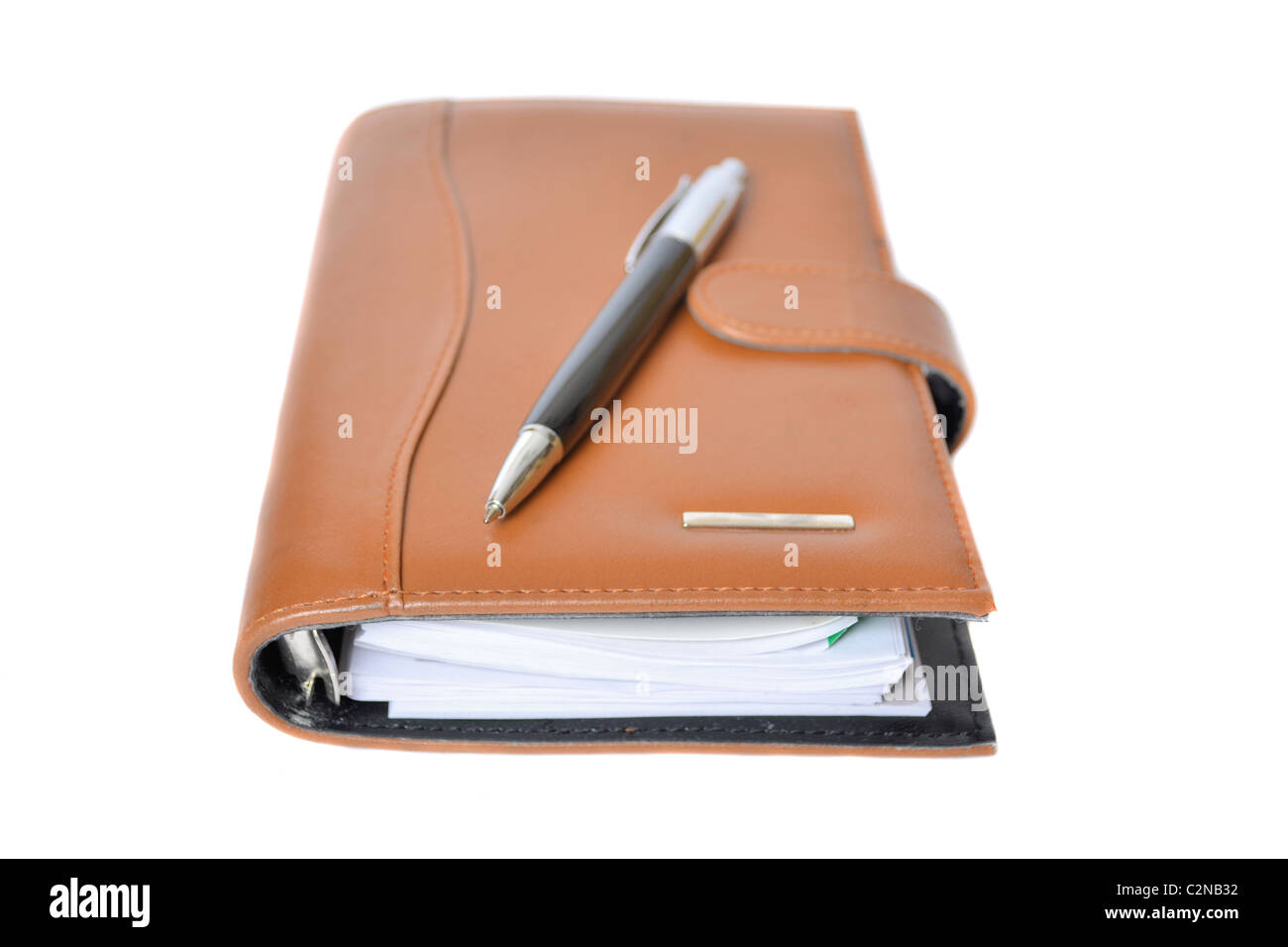 Daily planner with pen on a white background Stock Photo - Alamy