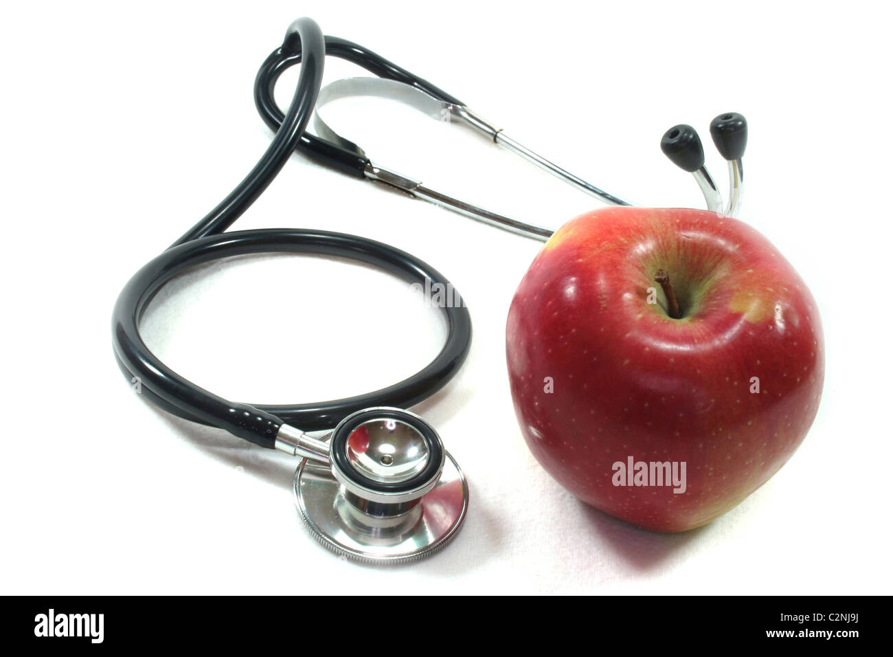 Stethoscope with apple on a white background Stock Photo - Alamy