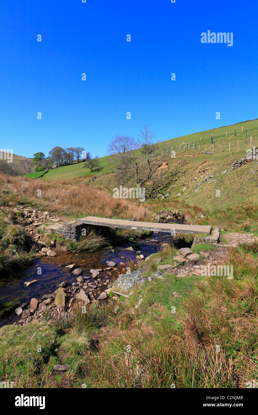 Wooden footbridge over the River Sett near Hayfield, Derbyshire, Peak ...