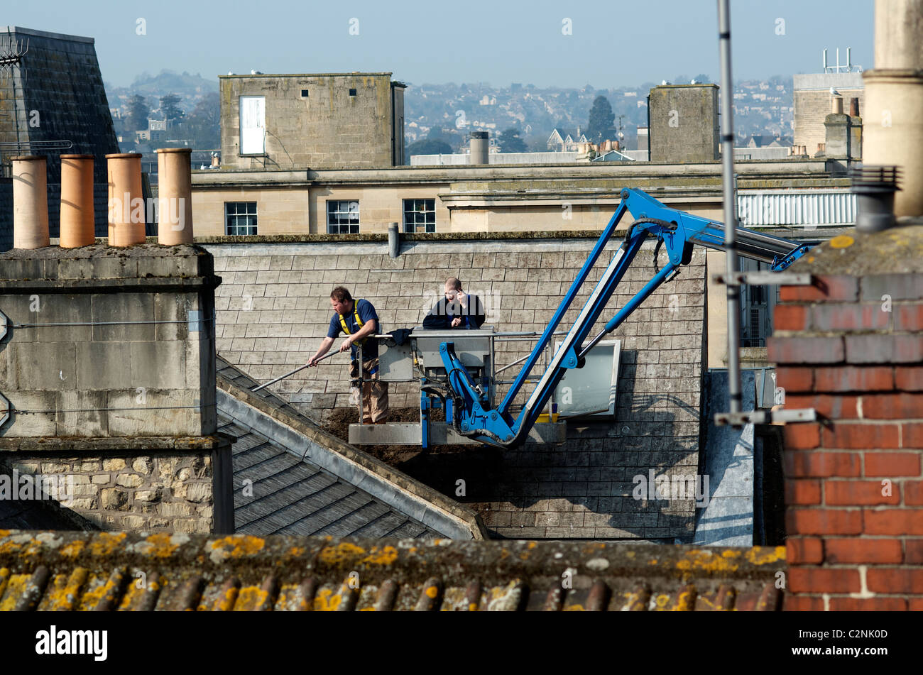 Men Cleaning Roof, Property Maintainance Stock Photo - Alamy