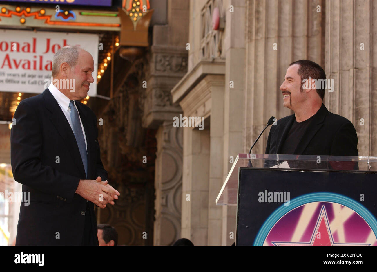 John Travolta and Michael D. Eisner Michael D. Eisner honoured with the ...