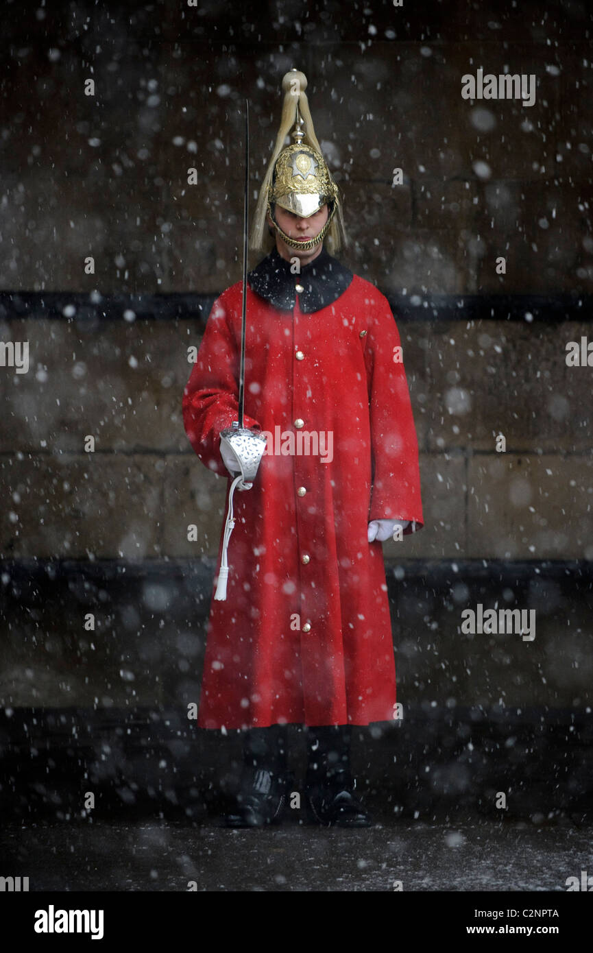 Snow falls across London, The Royal Horseguards prepare for the ...