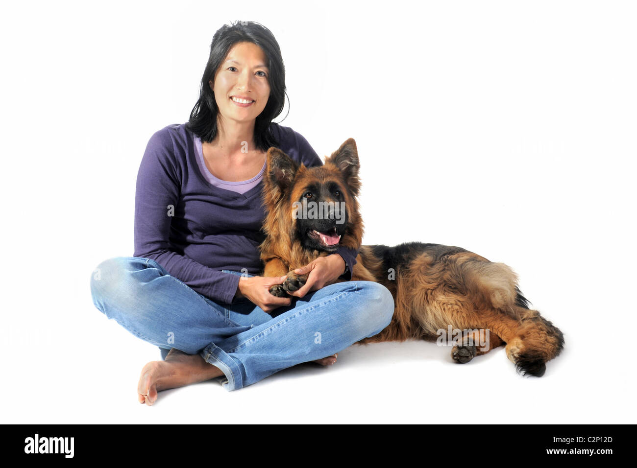 portrait of a purebred german shepherd and chinese girl in front of ...