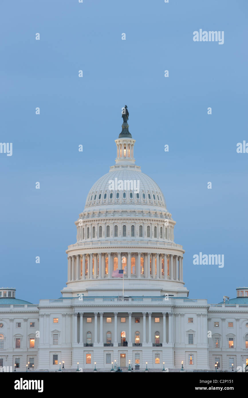 Lights illuminate the US Capitol Building after sunset in Washington ...