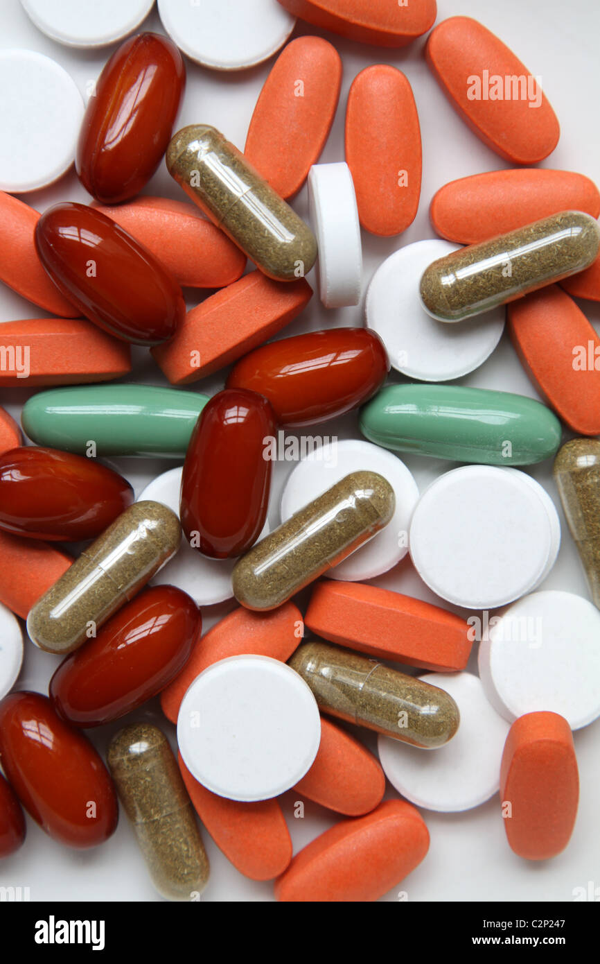 Selection of pills tablets and capsules against white background Stock ...