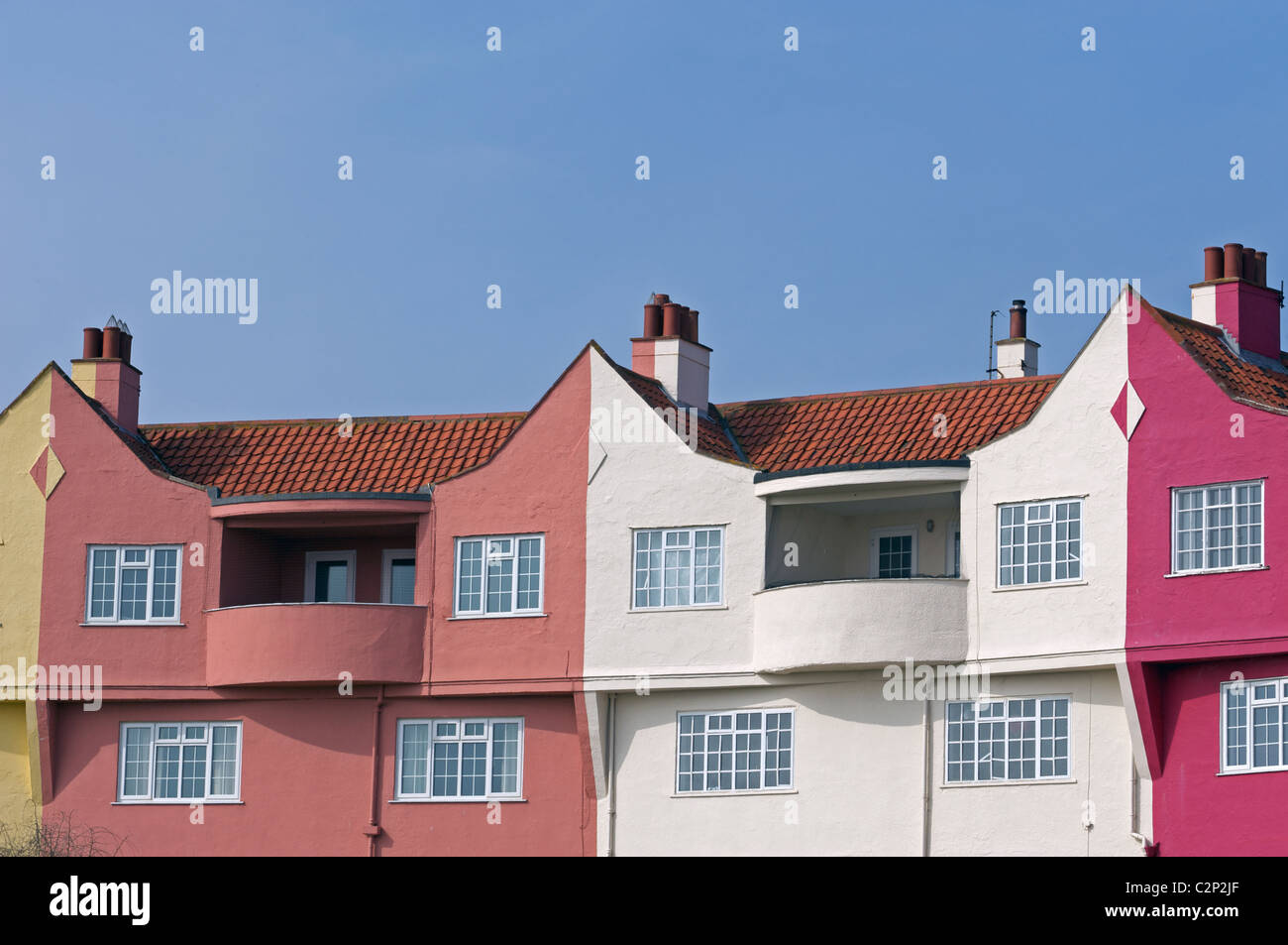 Brightly painted seaside houses, Thorpeness, Suffolk, UK Stock Photo ...