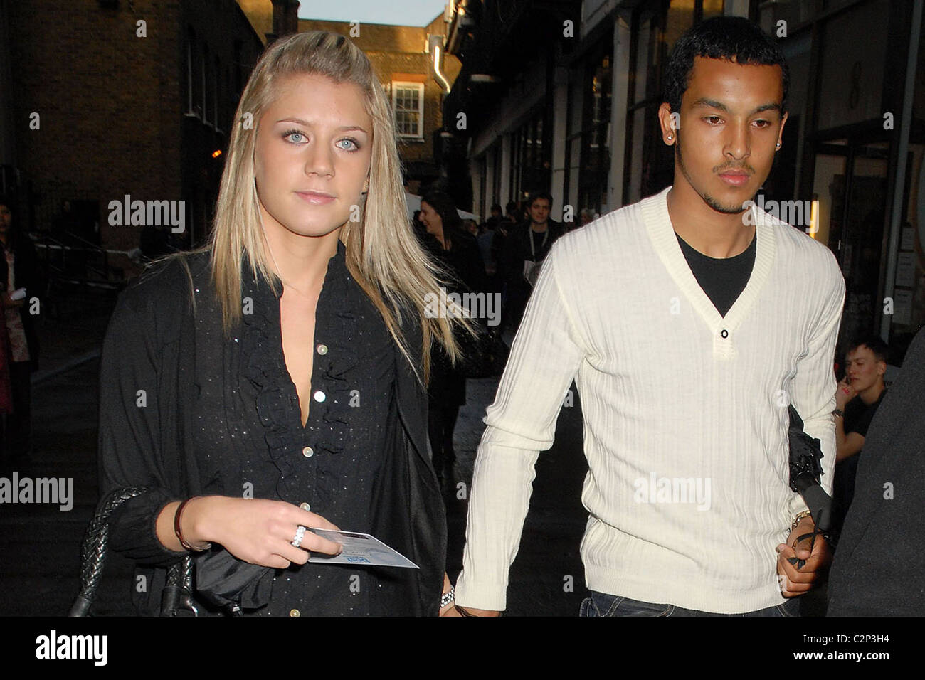 Melanie Slade and Theo Walcott arrive at the private viewing of 'Get ...