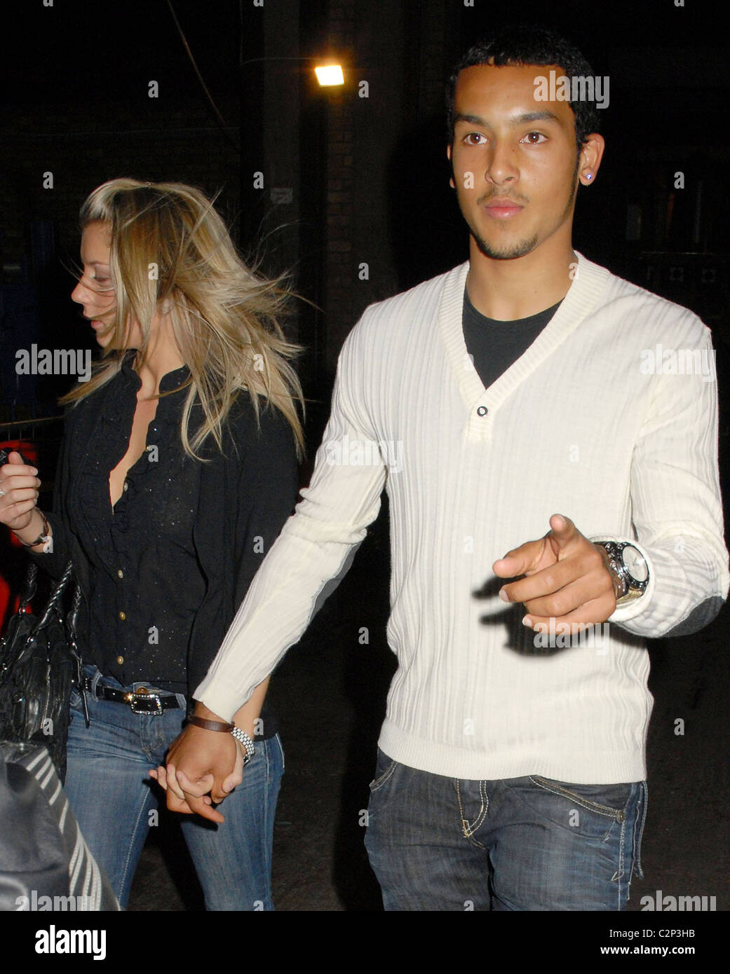 Melanie Slade and Theo Walcott arrive at the private viewing of 'Get ...