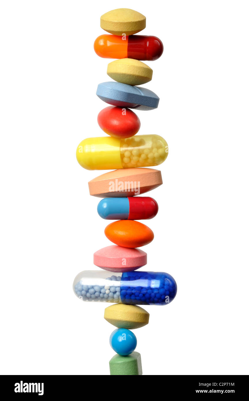 Stack of pills and capsules isolated on white background Stock Photo ...